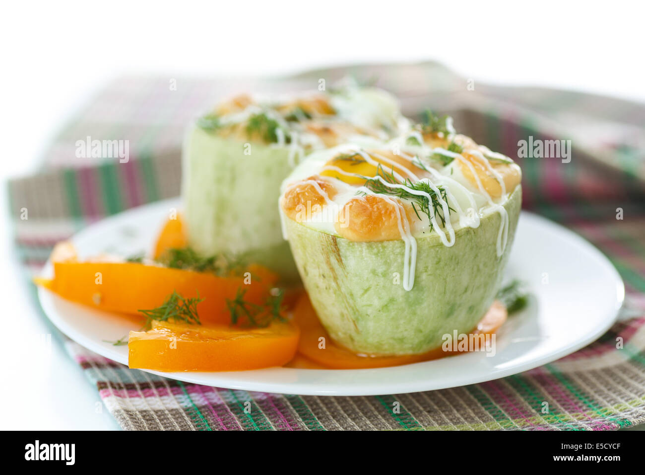 zucchini baked inside with egg and cheese Stock Photo - Alamy