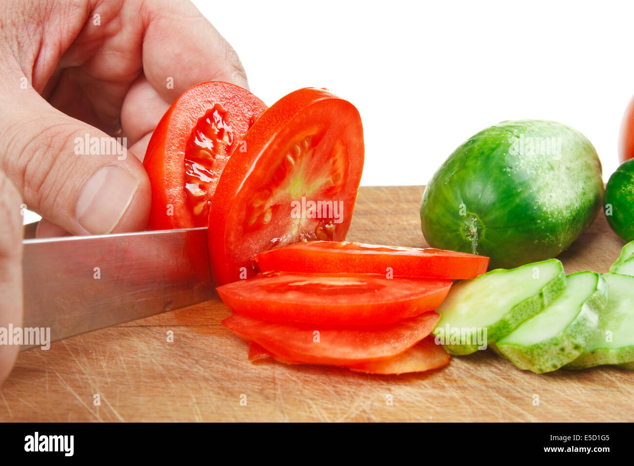 chop tomatoes and cucumbers isolated on white background Stock Photo ...