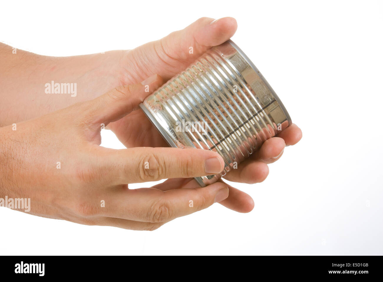 Food can in hand isolated on white background Stock Photo - Alamy