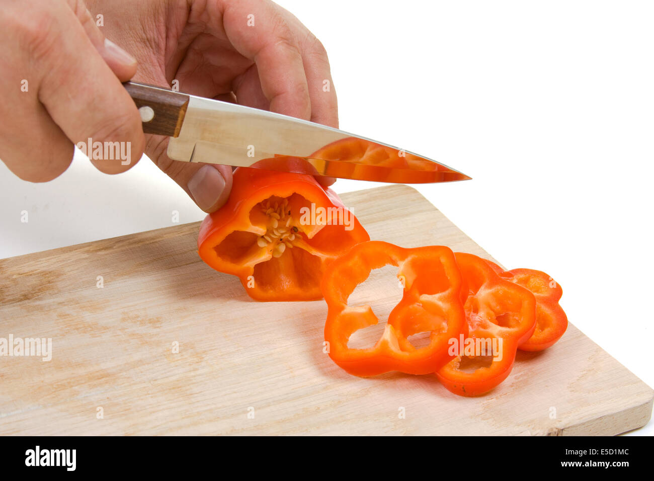 Cutting pepper on the board isolated on white background Stock Photo ...