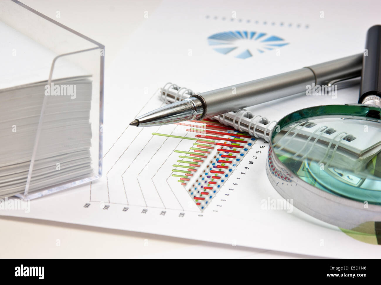 pen, magnifying glass and the working paper with a diagram Stock Photo ...