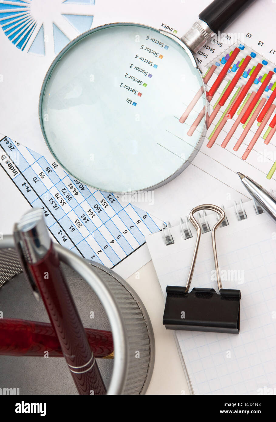pen, magnifying glass and the working paper with a diagram Stock Photo ...