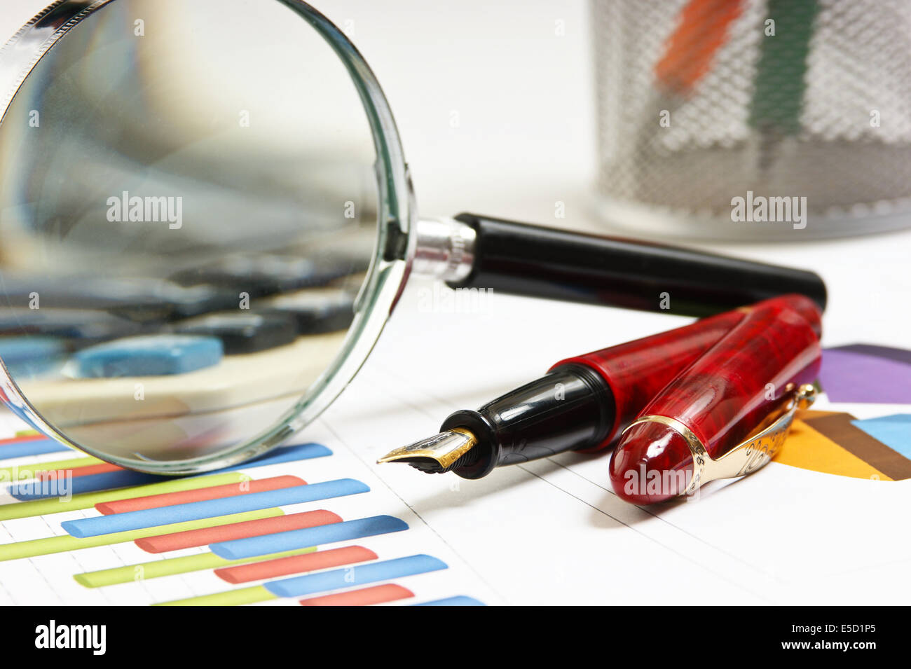 pen, magnifying glass and the working paper with a diagram Stock Photo ...