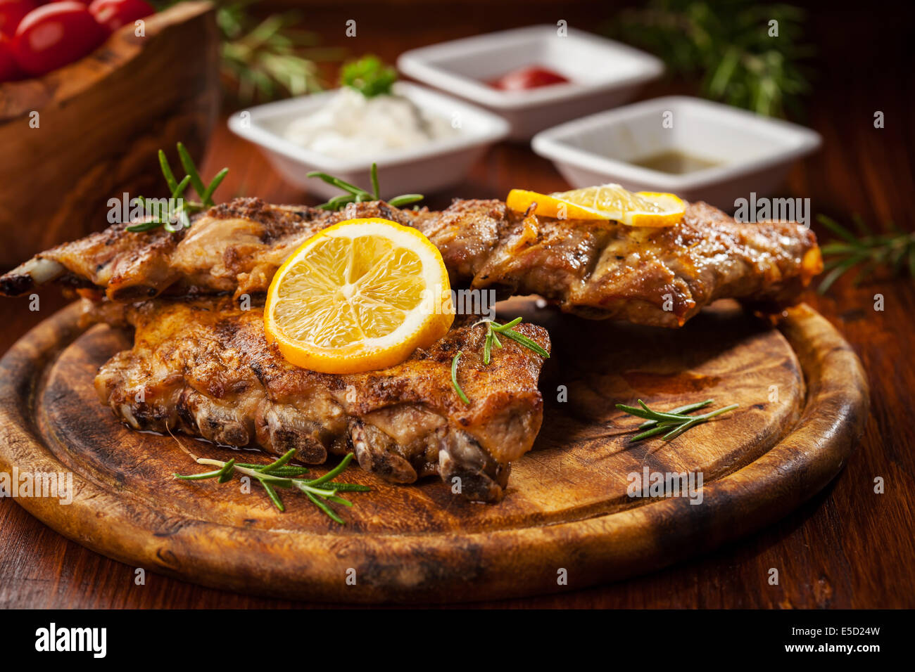 BBQ spare ribs with orange and dips Stock Photo - Alamy