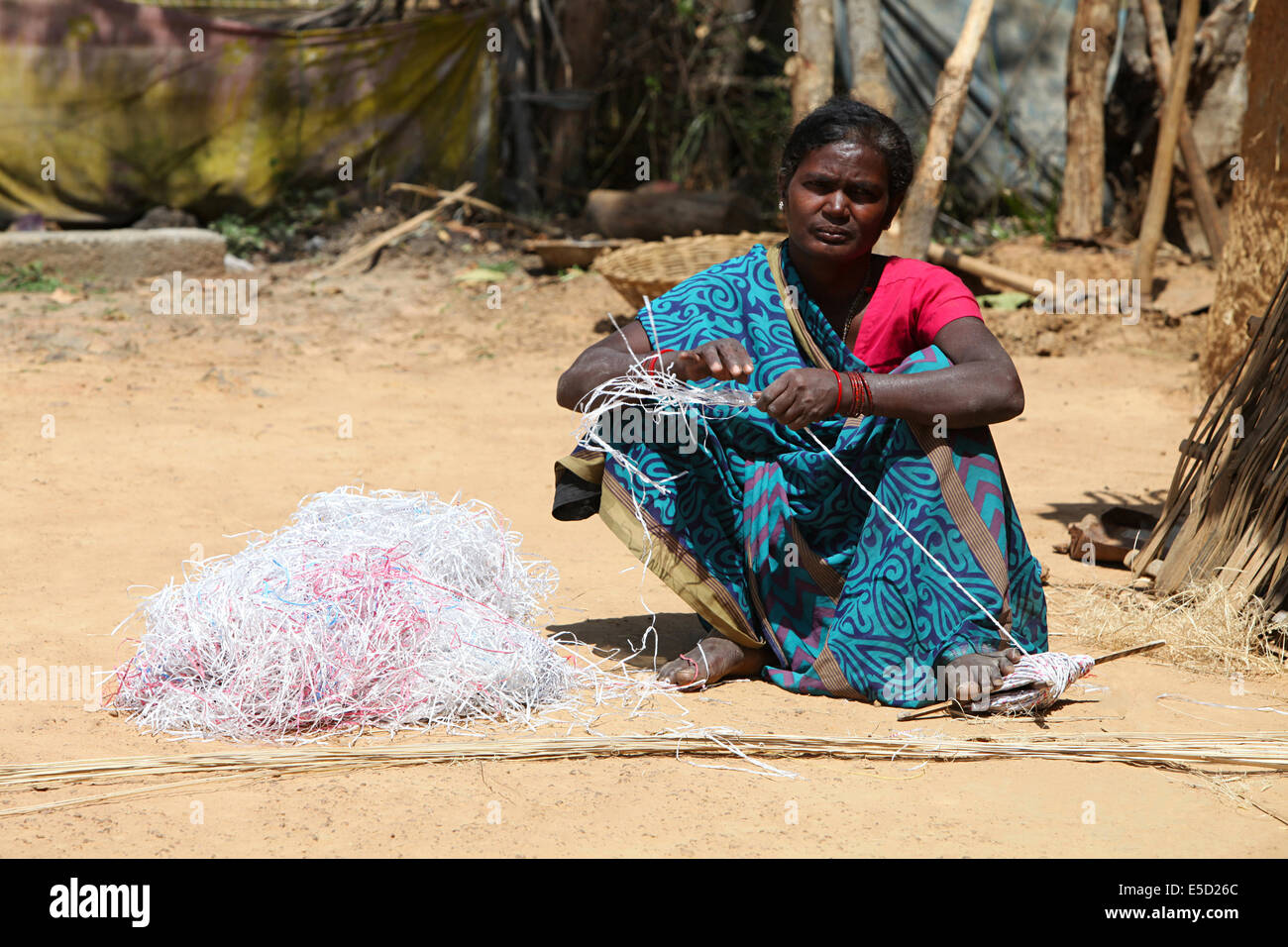 Tribal Woman making rope, Birhor tribe. Chueya Village, Korba District ...