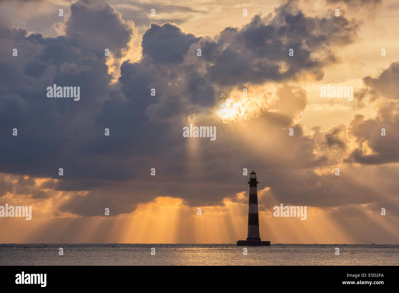 Sunrise rays at the Morris Island Lighthouse in Charleston South ...