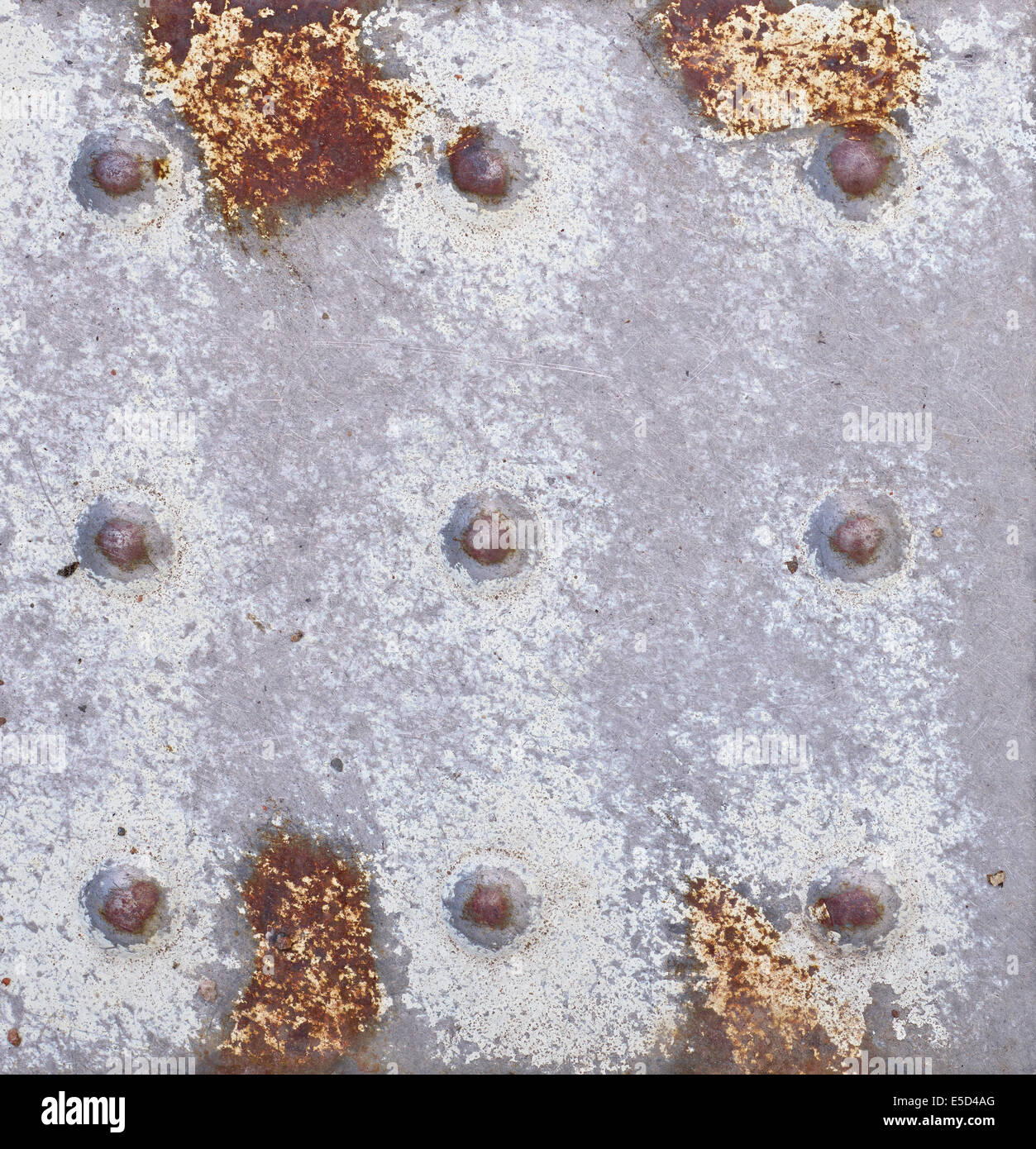 Close up, the rusty steel plate with a nine rivets Stock Photo - Alamy