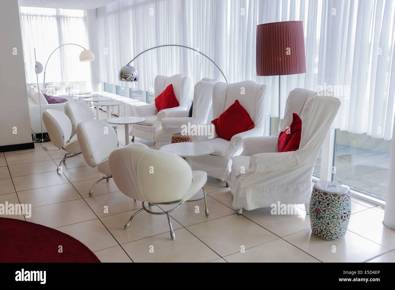 White chairs in a hotel lobby Stock Photo - Alamy