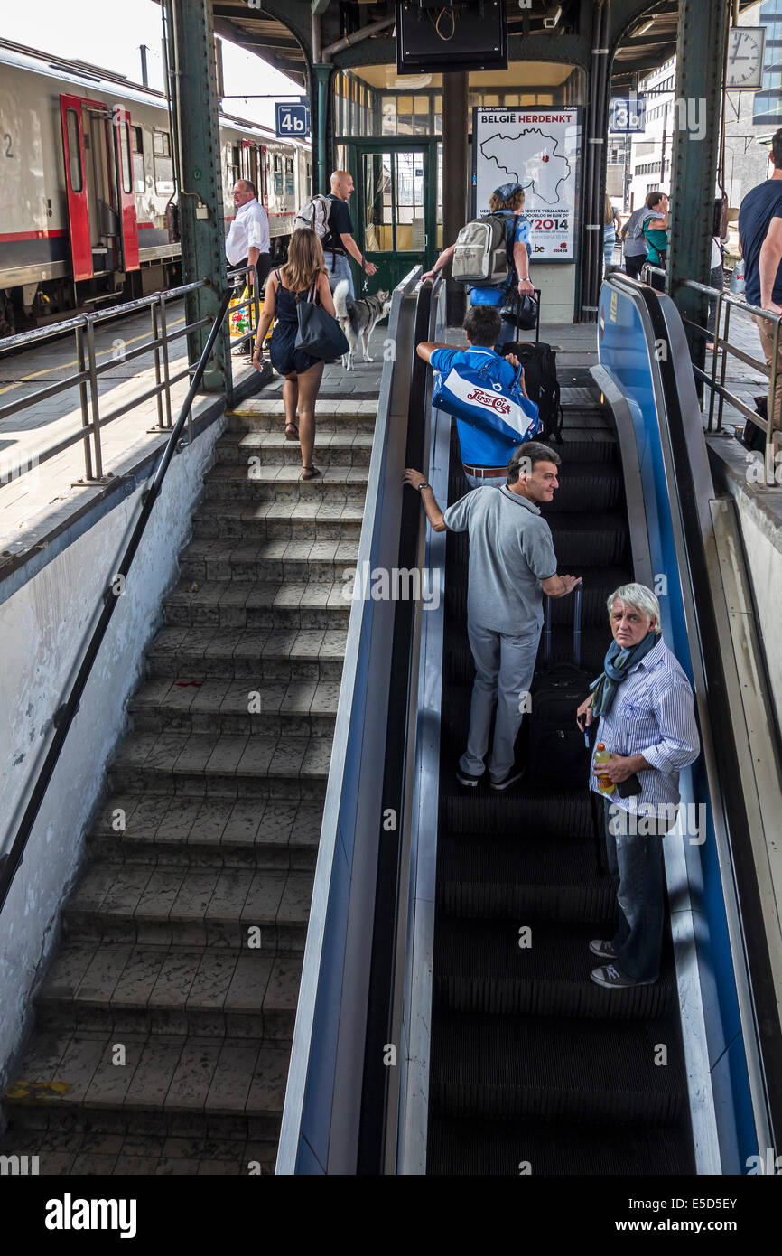 Commuters taking the stairs to railroad train platform in Gent-Sint ...
