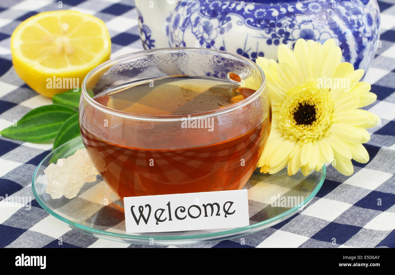 Welcome card with cup of tea, lemon and cream gerbera daisy Stock Photo ...