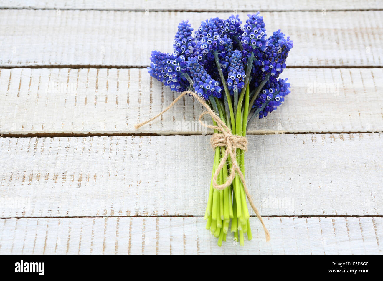 lovely bouquet of spring flowers on wood background Stock Photo - Alamy