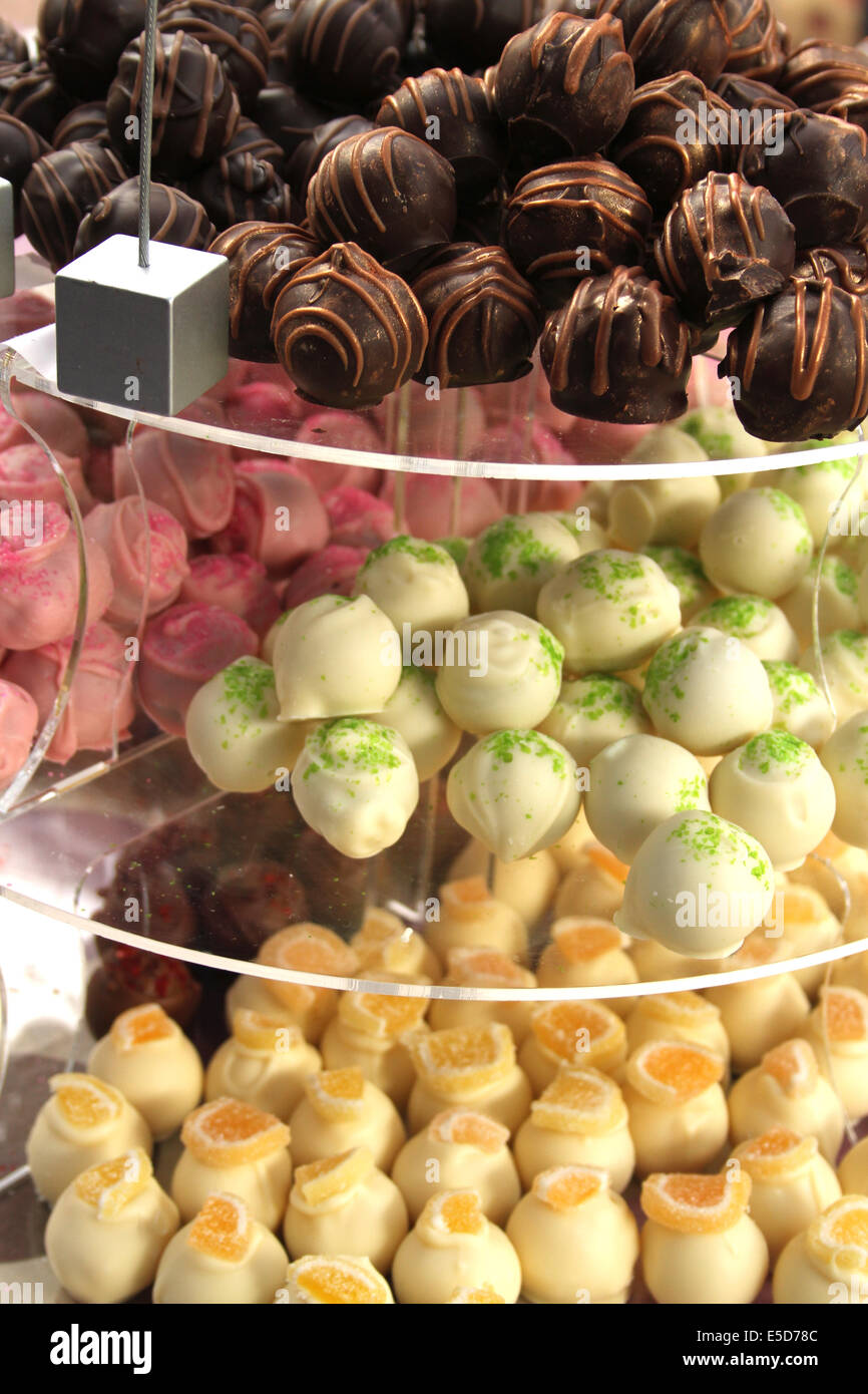Assorted chocolates artistically displayed on a stand Stock Photo - Alamy