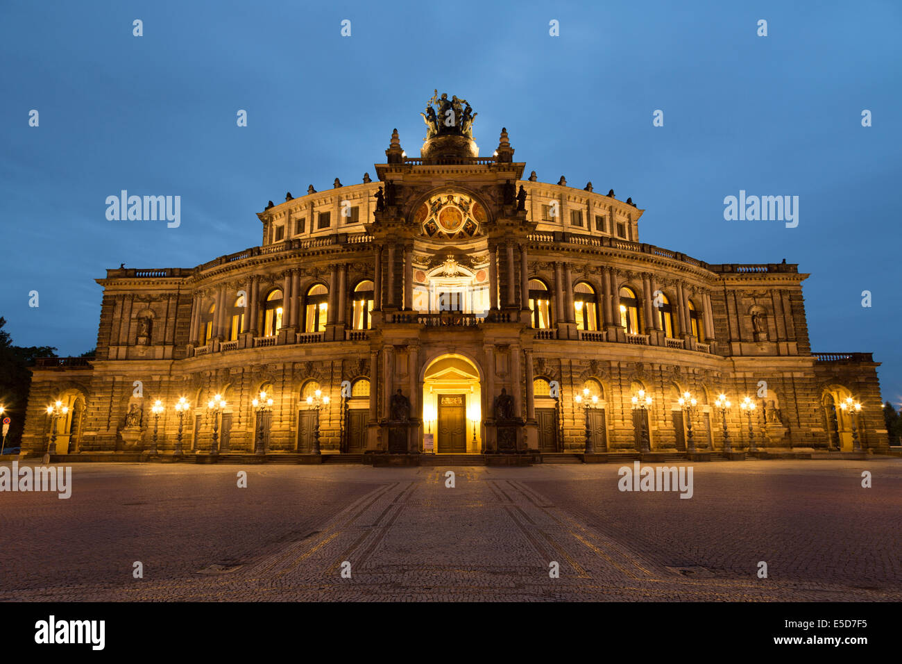 A photograph of the opera house in Dresden lit up at night time Stock ...