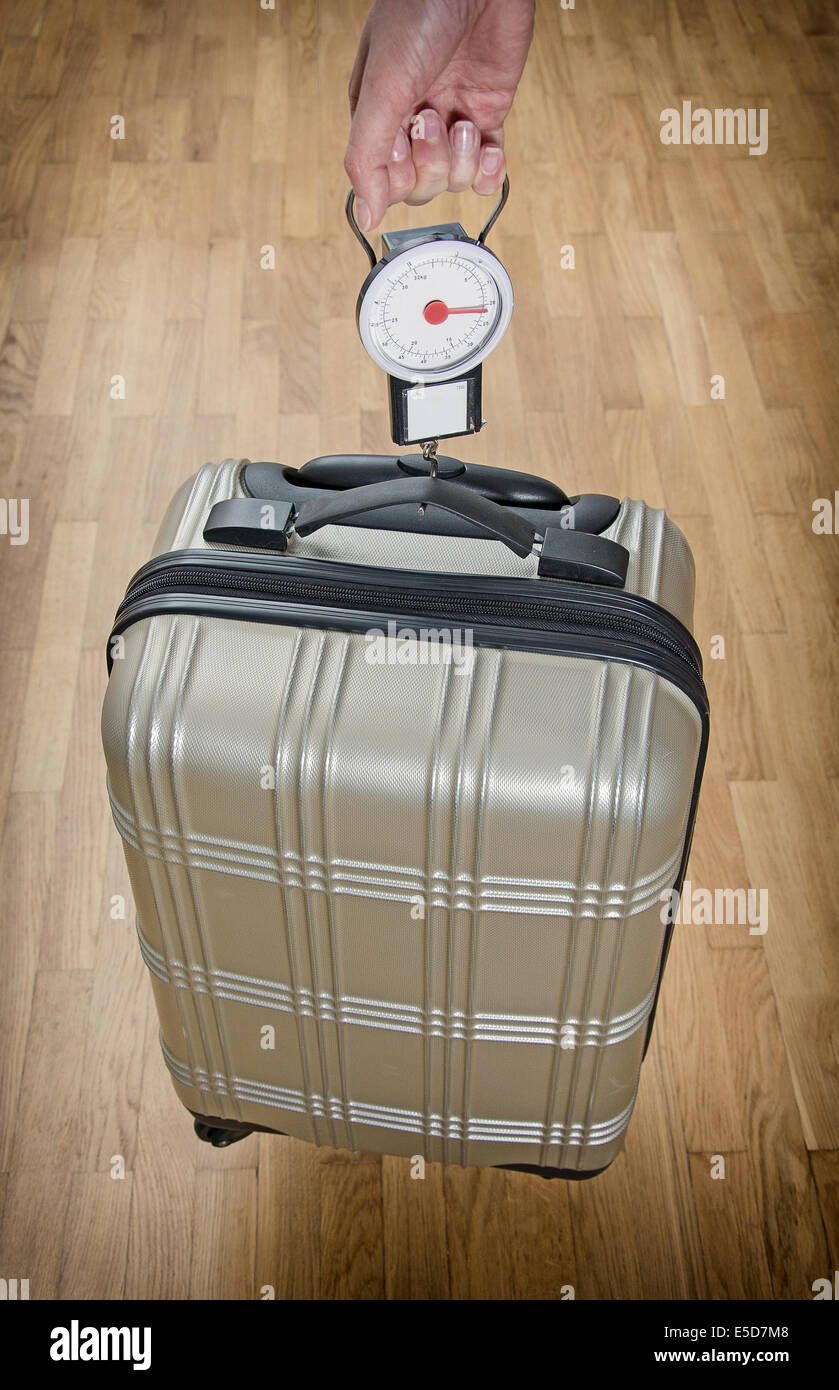 Hand luggage measurement using steelyard balance Stock Photo - Alamy