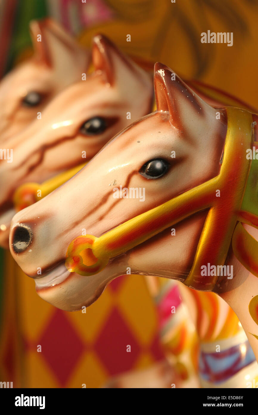 Three wooden carousel horse heads abstract Stock Photo - Alamy