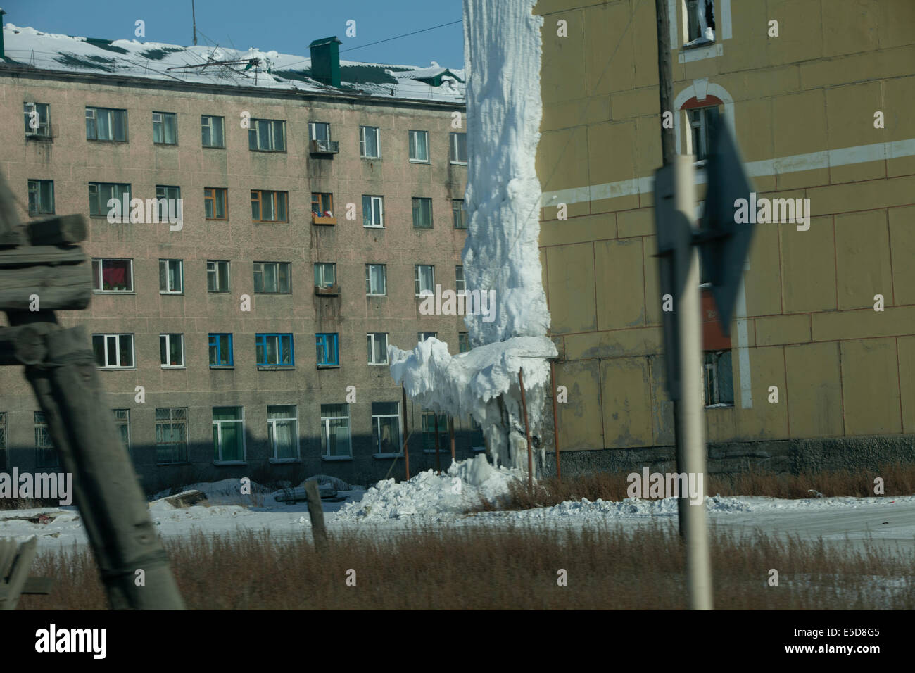 Russian city buildings block snow frozen pipe Stock Photo - Alamy