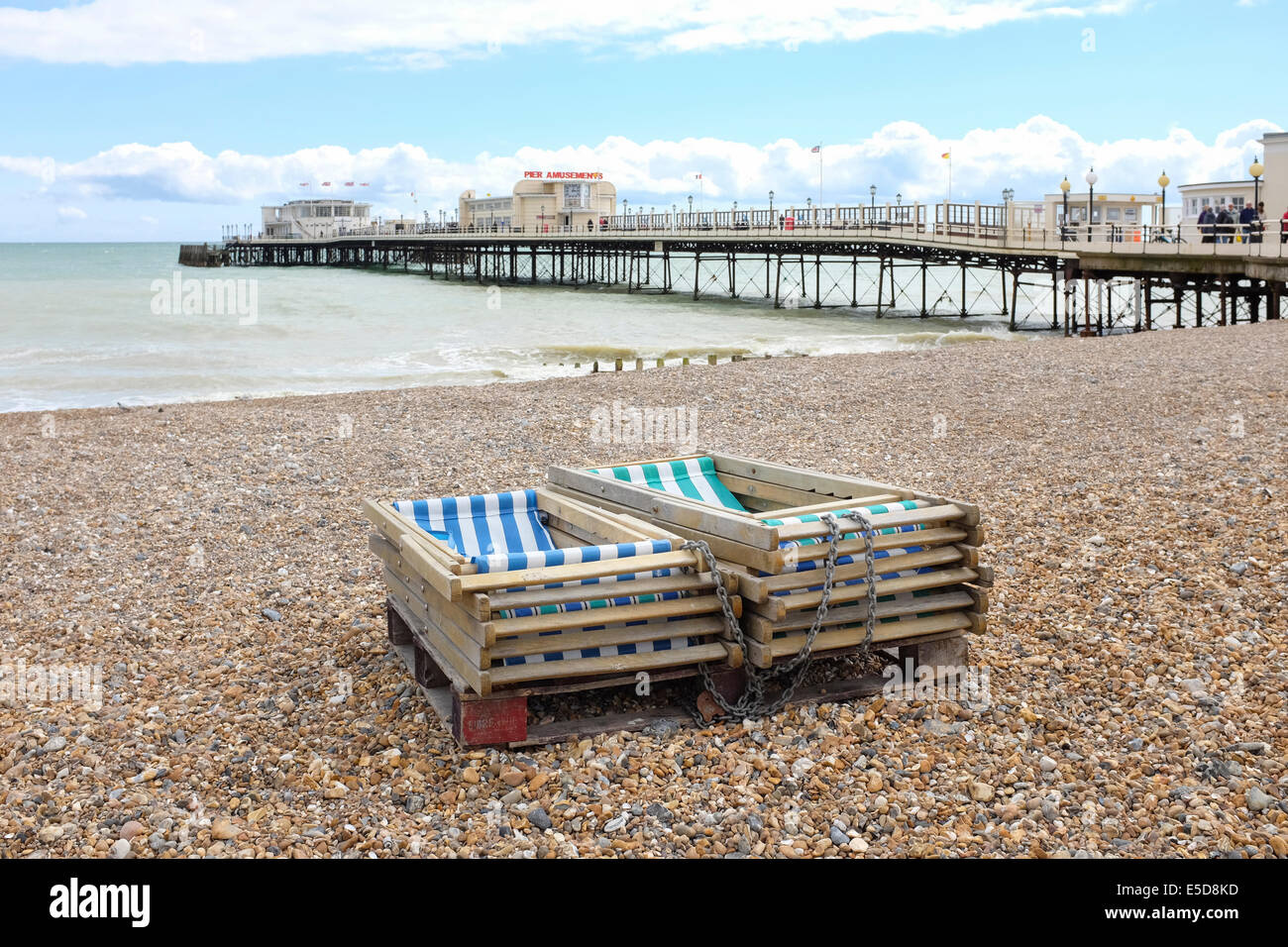 Collected deck loungers on Worthing beach, England, UK Stock Photo - Alamy