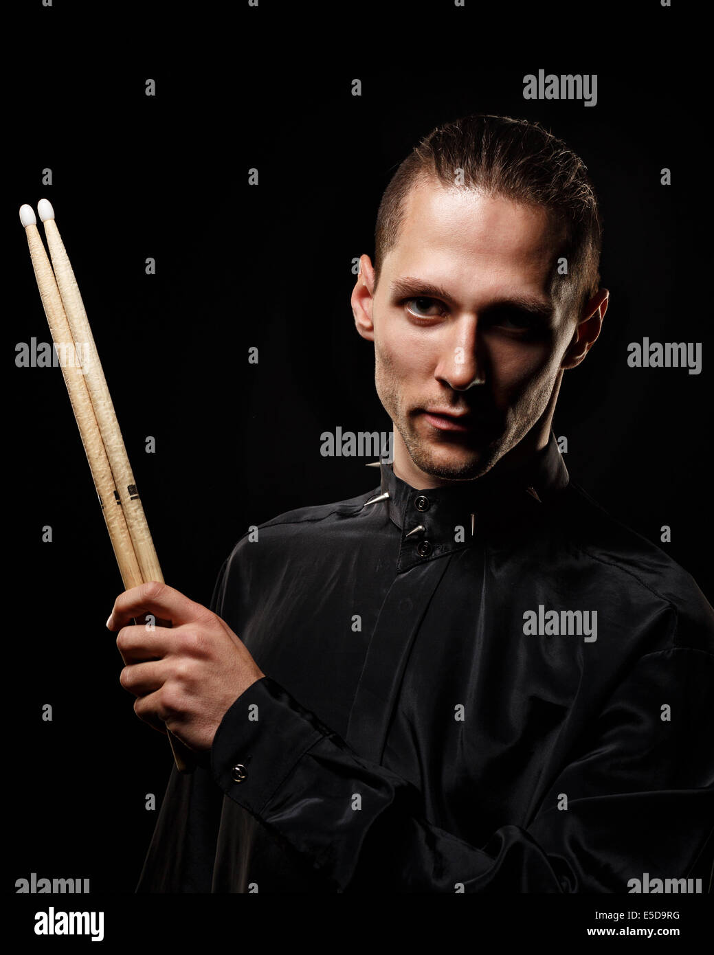 Young drummer man portrait artist of rock music Stock Photo - Alamy