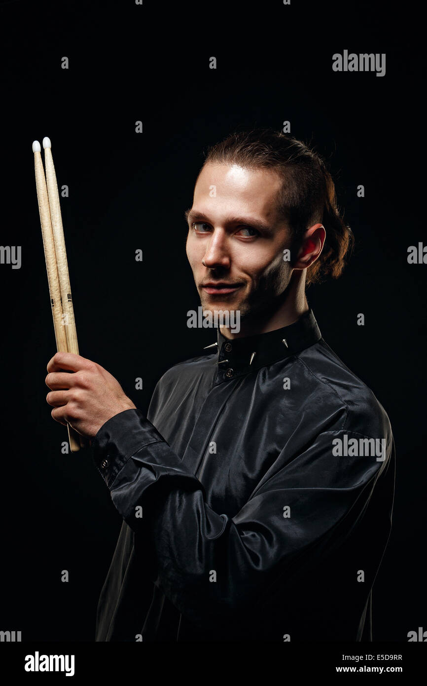 Young drummer man portrait artist of rock music Stock Photo - Alamy