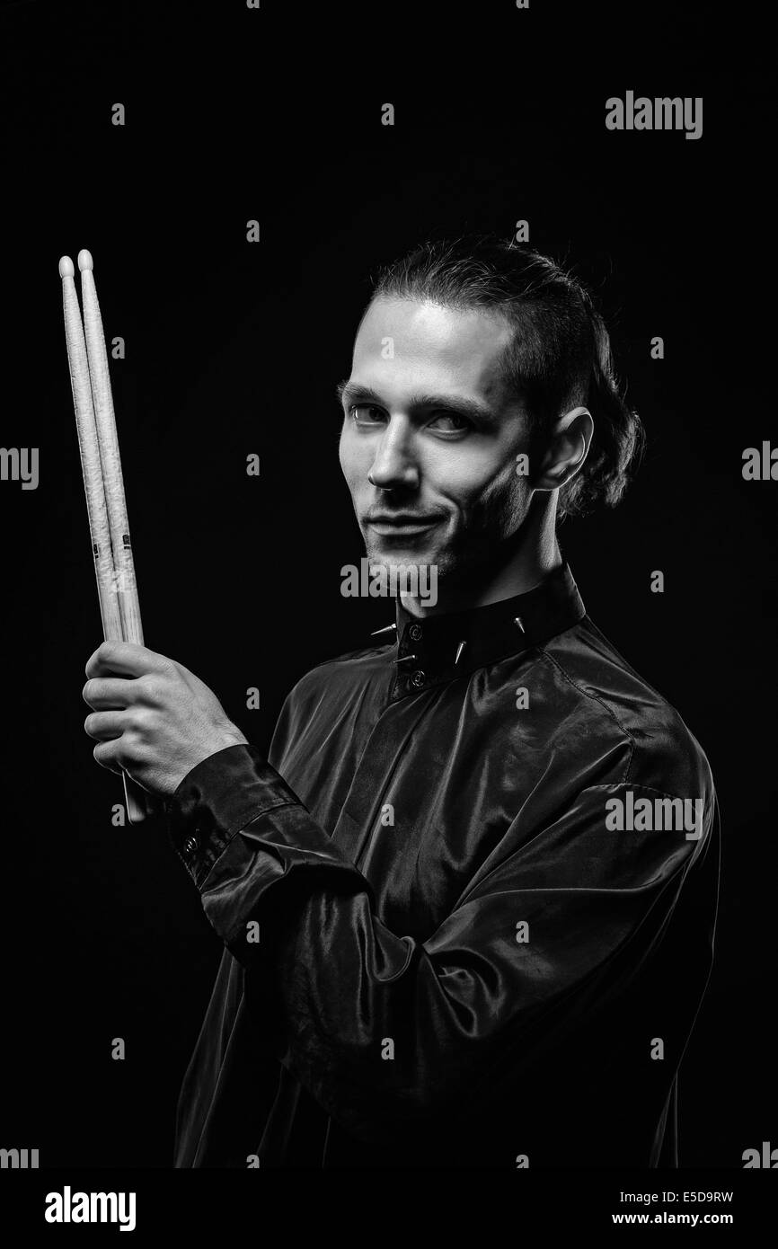 Young drummer man portrait artist of rock music Stock Photo - Alamy