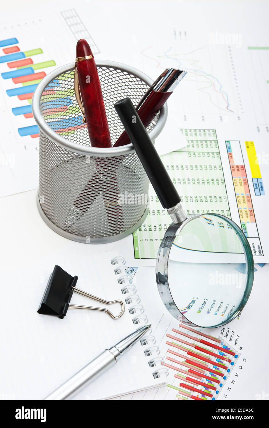 pen, magnifying glass and the working paper with a diagram Stock Photo ...