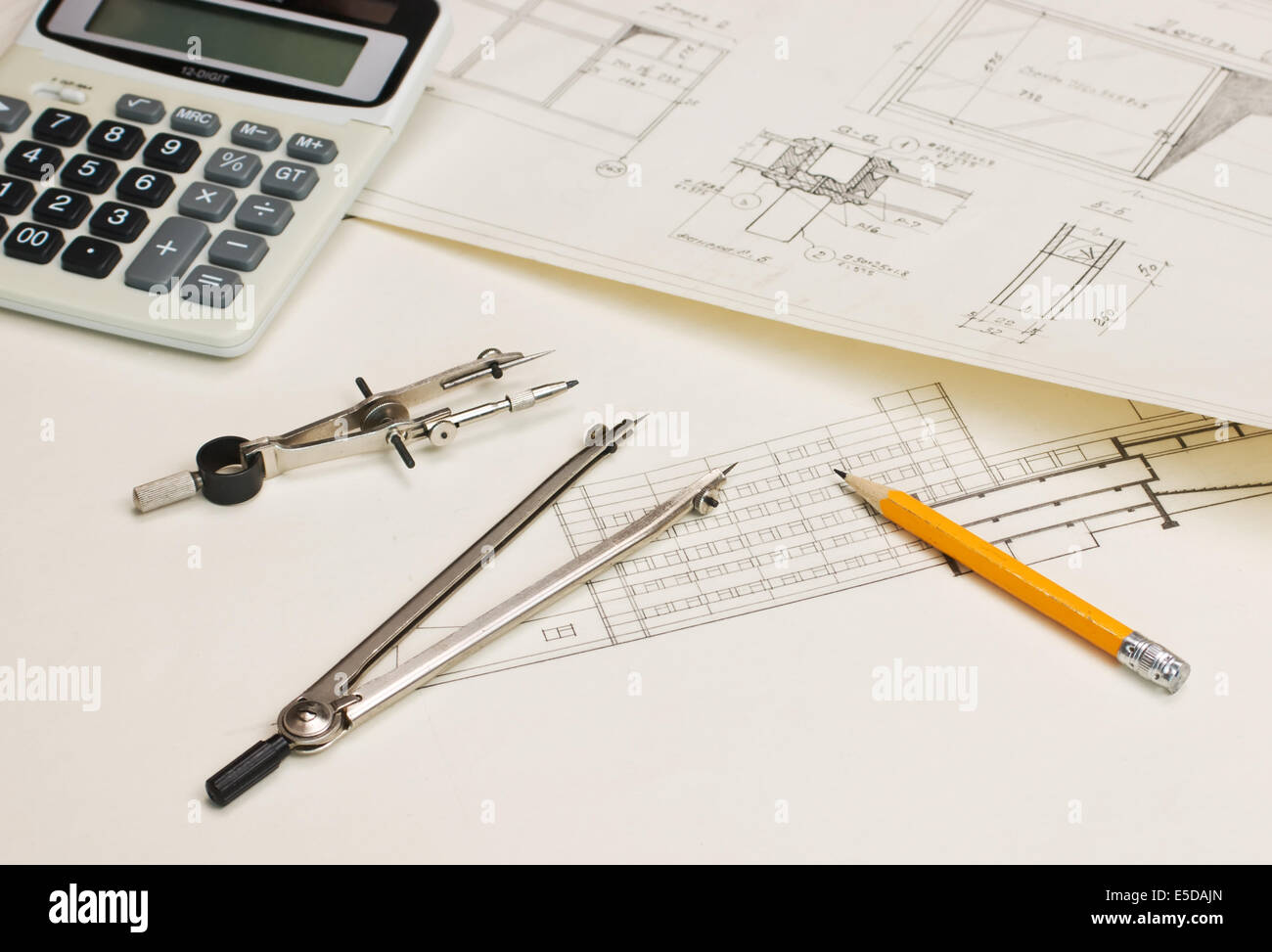 technical drawings and a calculator Stock Photo - Alamy