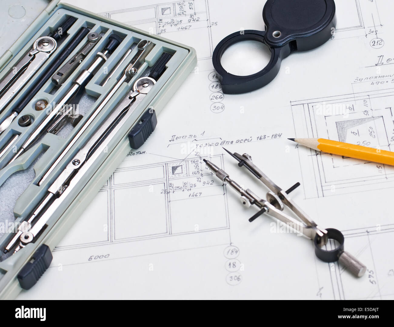 technical drawings and magnifying glass Stock Photo - Alamy