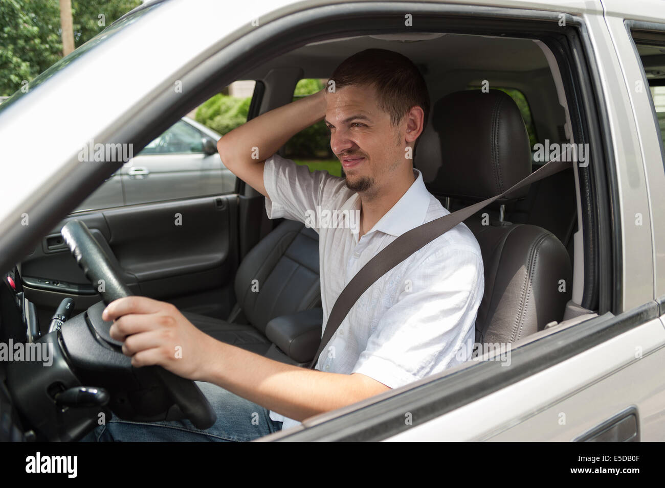 Young caucasian driver is thinking about a problem Stock Photo - Alamy
