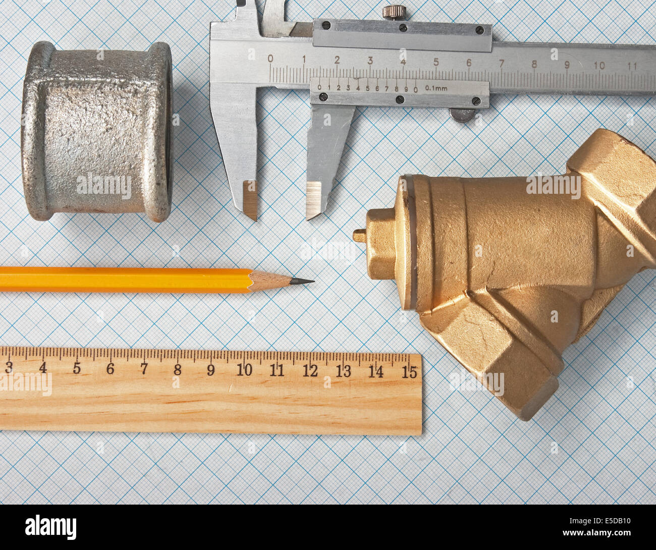 water inlet valve on a background of graph paper Stock Photo - Alamy