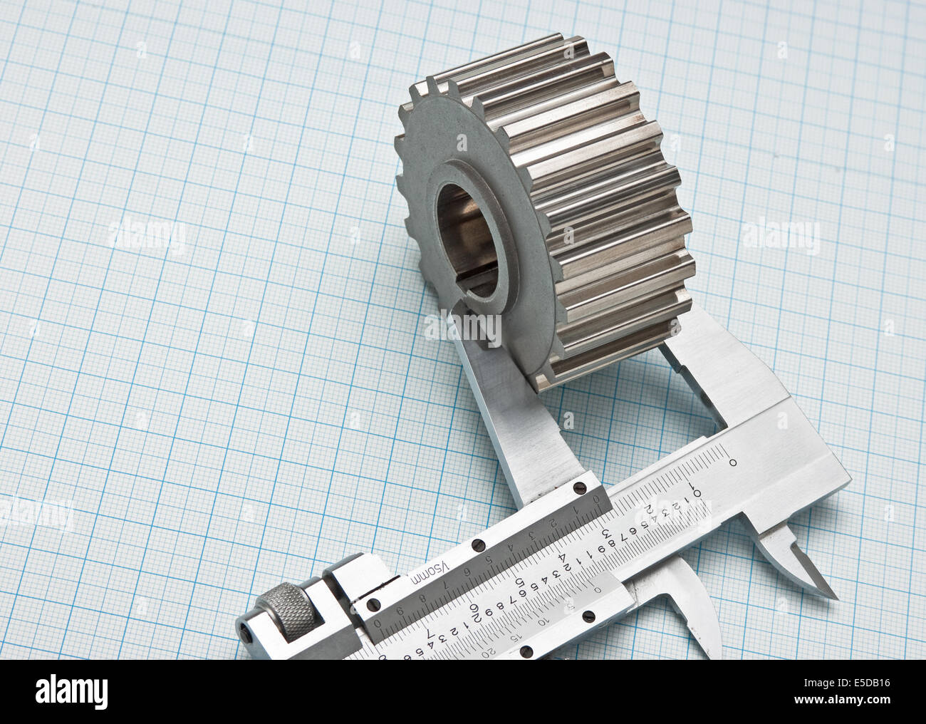 gears and caliper on graph paper Stock Photo - Alamy