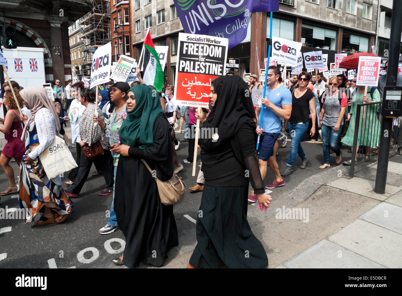 Muslim women in black burkas demonstrating on the streets of London UK ...