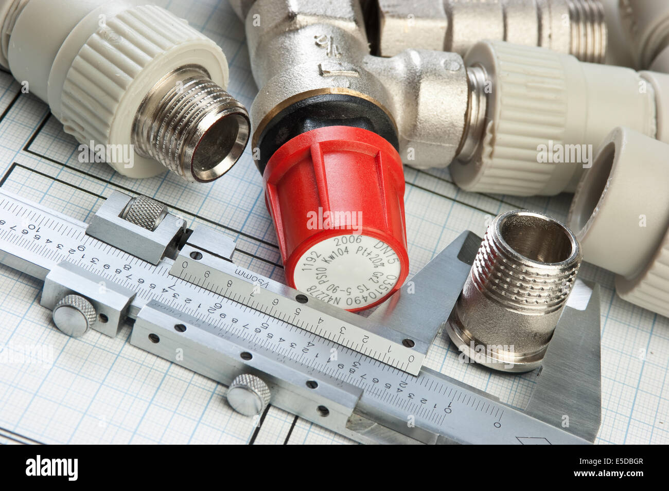Set plumbing fittings on the drawing Stock Photo - Alamy