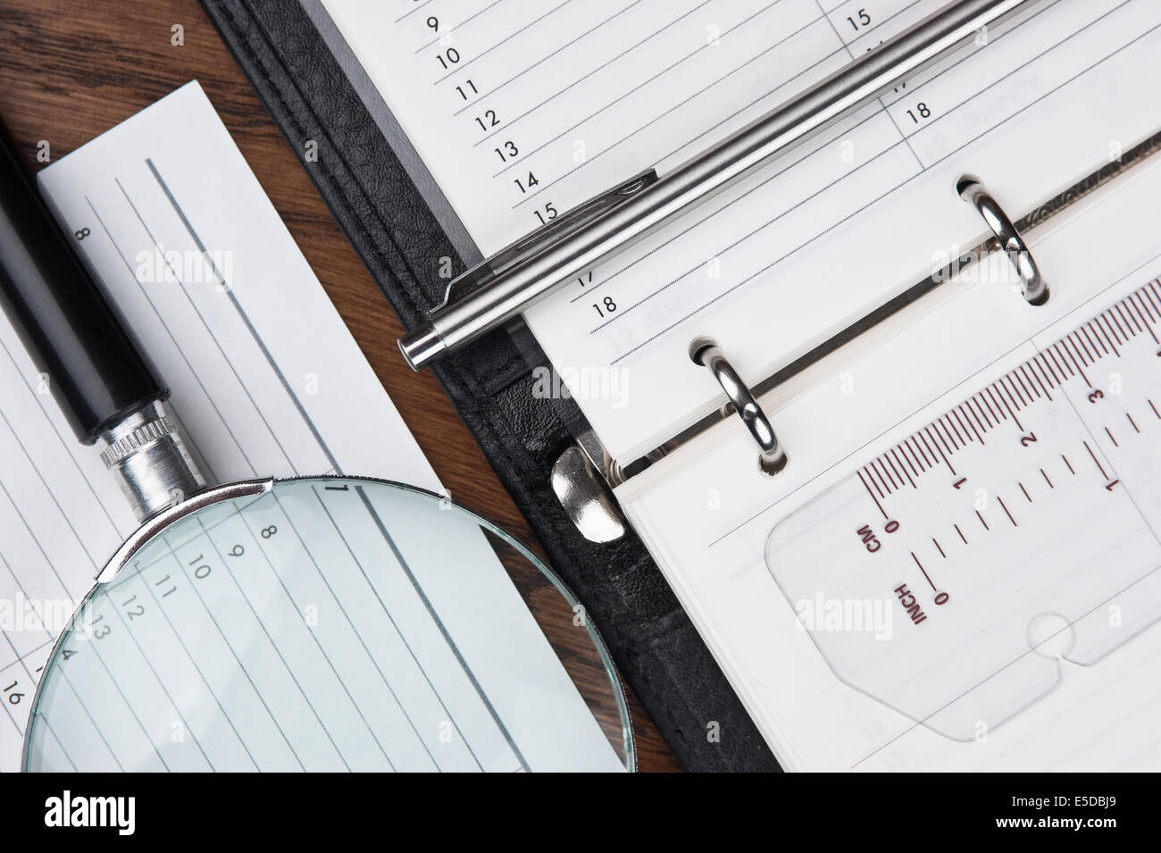 Book magnifying glass calculator hi-res stock photography and images ...