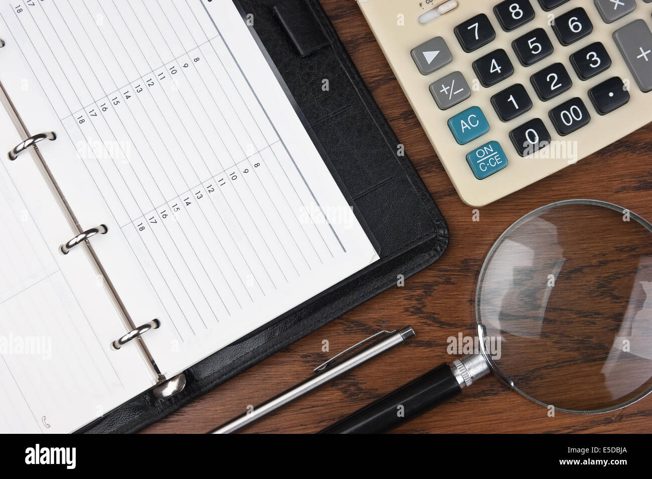 Book magnifying glass calculator hi-res stock photography and images ...