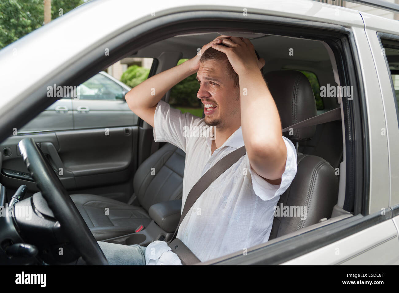 Young caucasian driver is shocked about something Stock Photo - Alamy