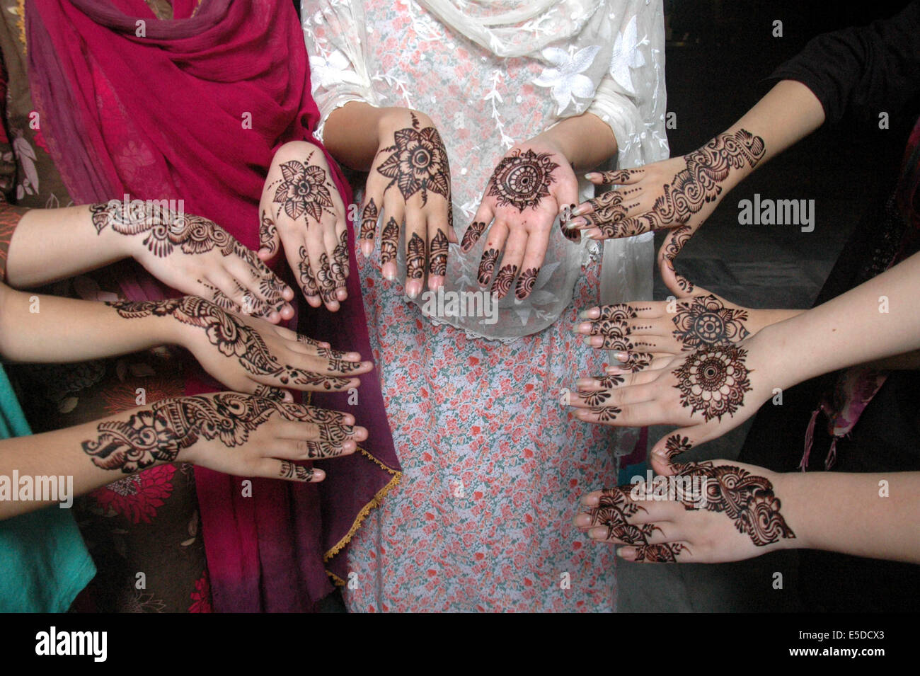 Lahore. 28th July, 2014. Pakistani girls show their hands painted with ...