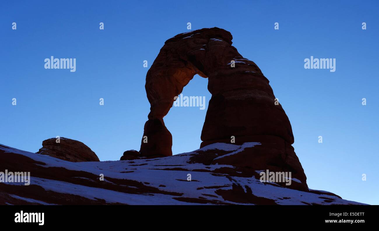Delicate Arch at Sunrise with Snow Stock Photo - Alamy