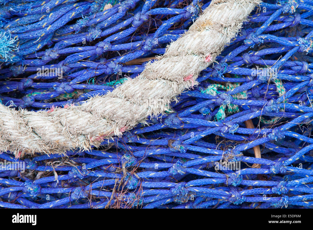Abstract background with a pile of fishing nets ready to be cast ...