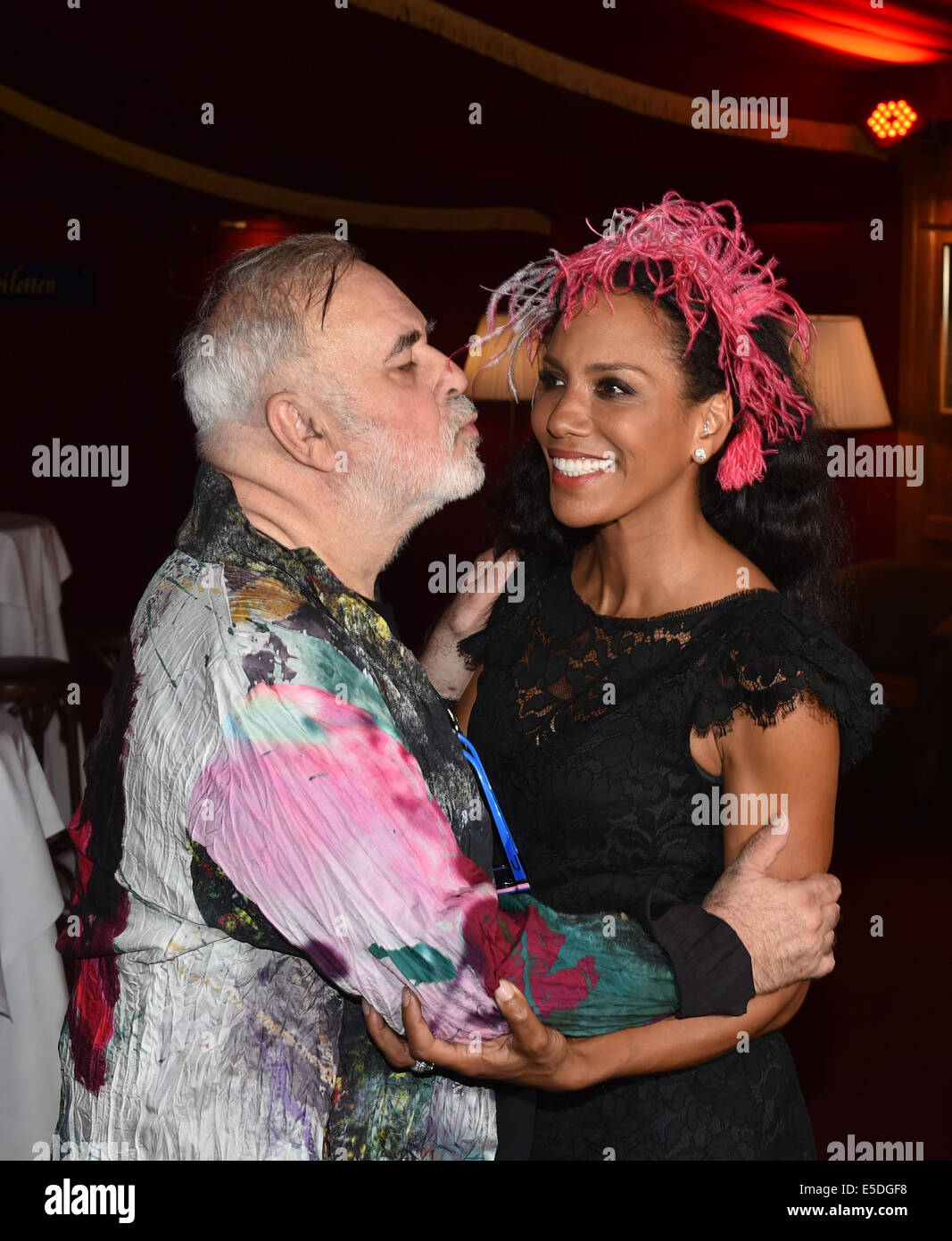 Celebrity hairdresser Udo Walz kisses Barbara Becker at the party for ...