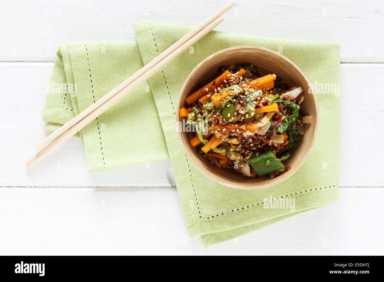 Wok dish with red rice Stock Photo - Alamy