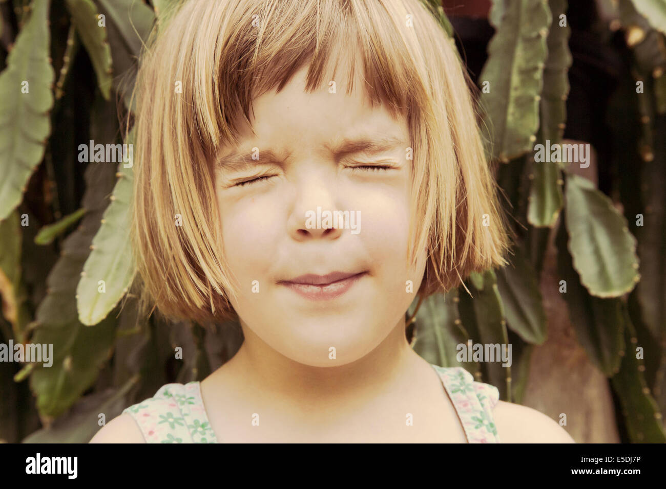 Portrait of little girl with closed eyes pouting mouth Stock Photo - Alamy