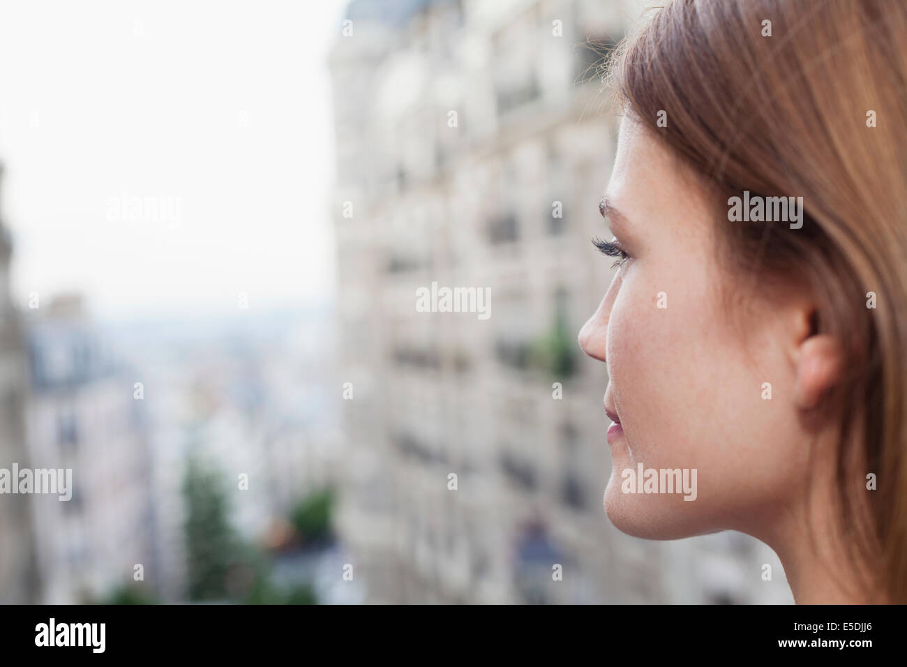 France, Paris, profile of smiling young woman Stock Photo - Alamy