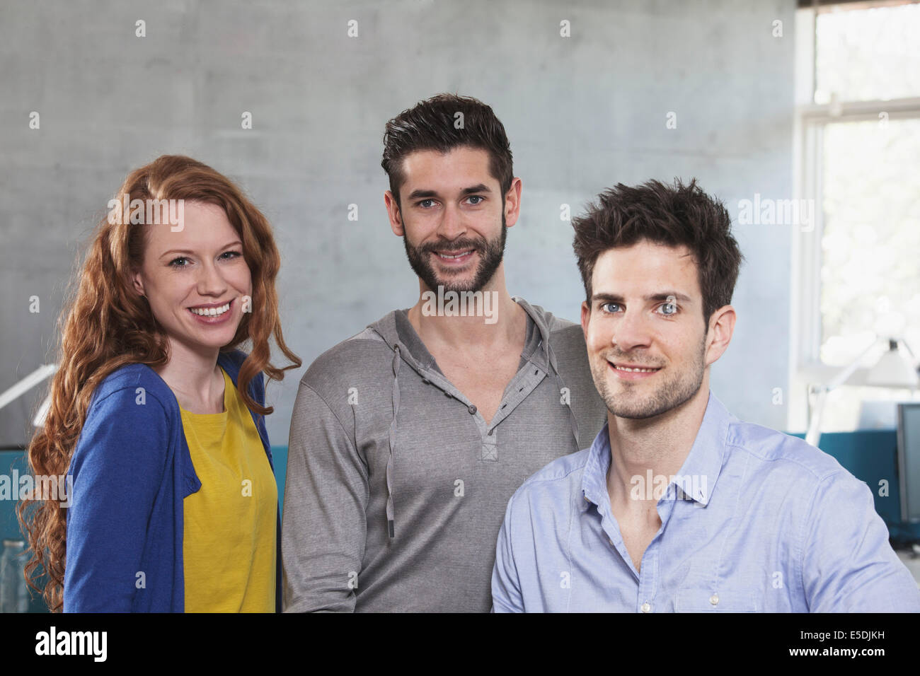 Group picture of three colleagues in the office Stock Photo - Alamy
