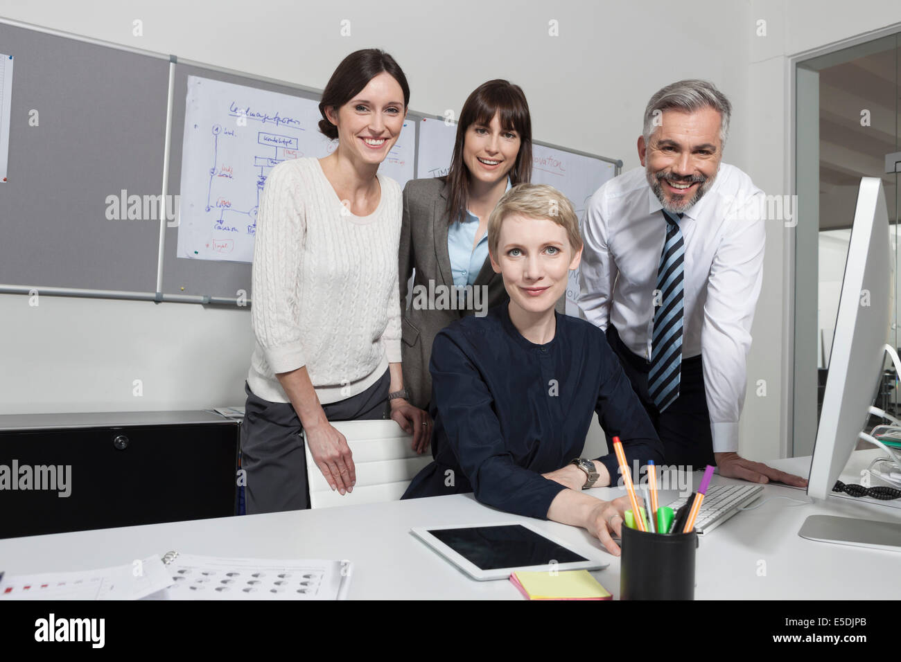 Germany, Munich Collegues in office working together Stock Photo - Alamy