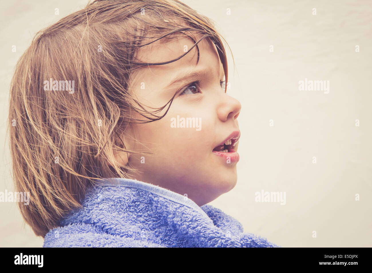Portrait of little girl wrapped in a towel Stock Photo - Alamy
