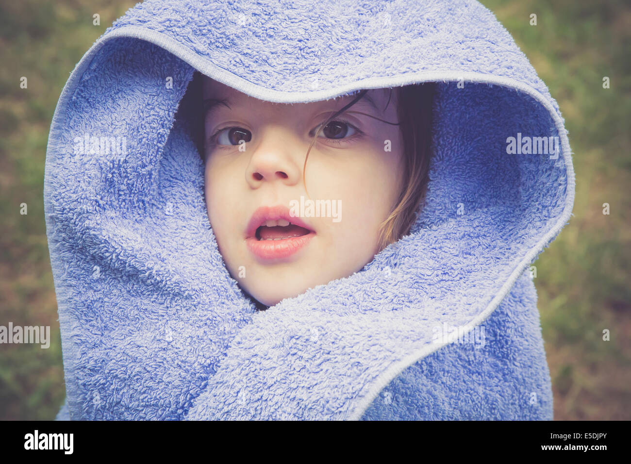 Little girl wrapped in a towel Stock Photo - Alamy