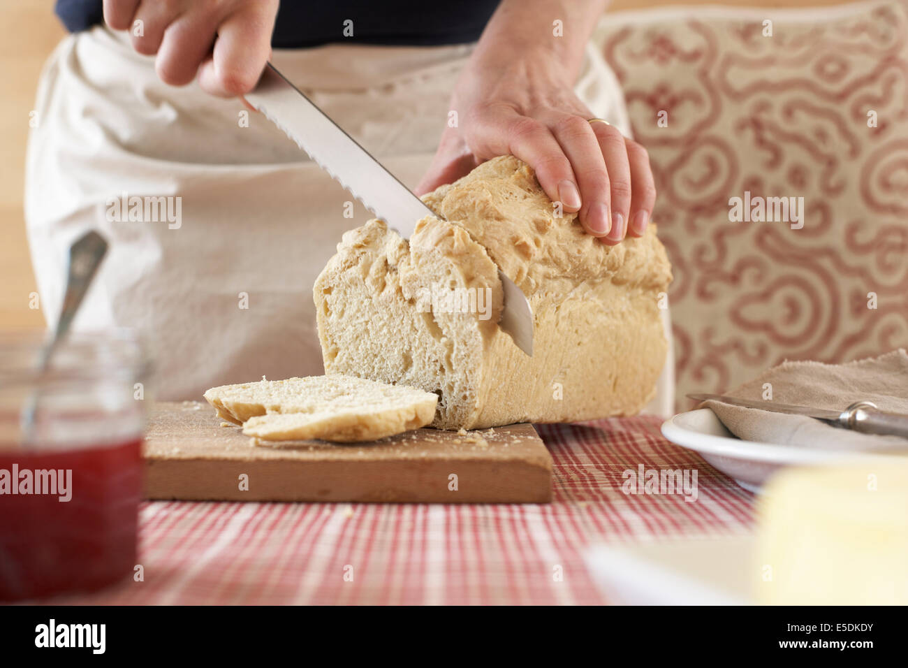 Midsection woman cutting bread hi-res stock photography and images - Alamy