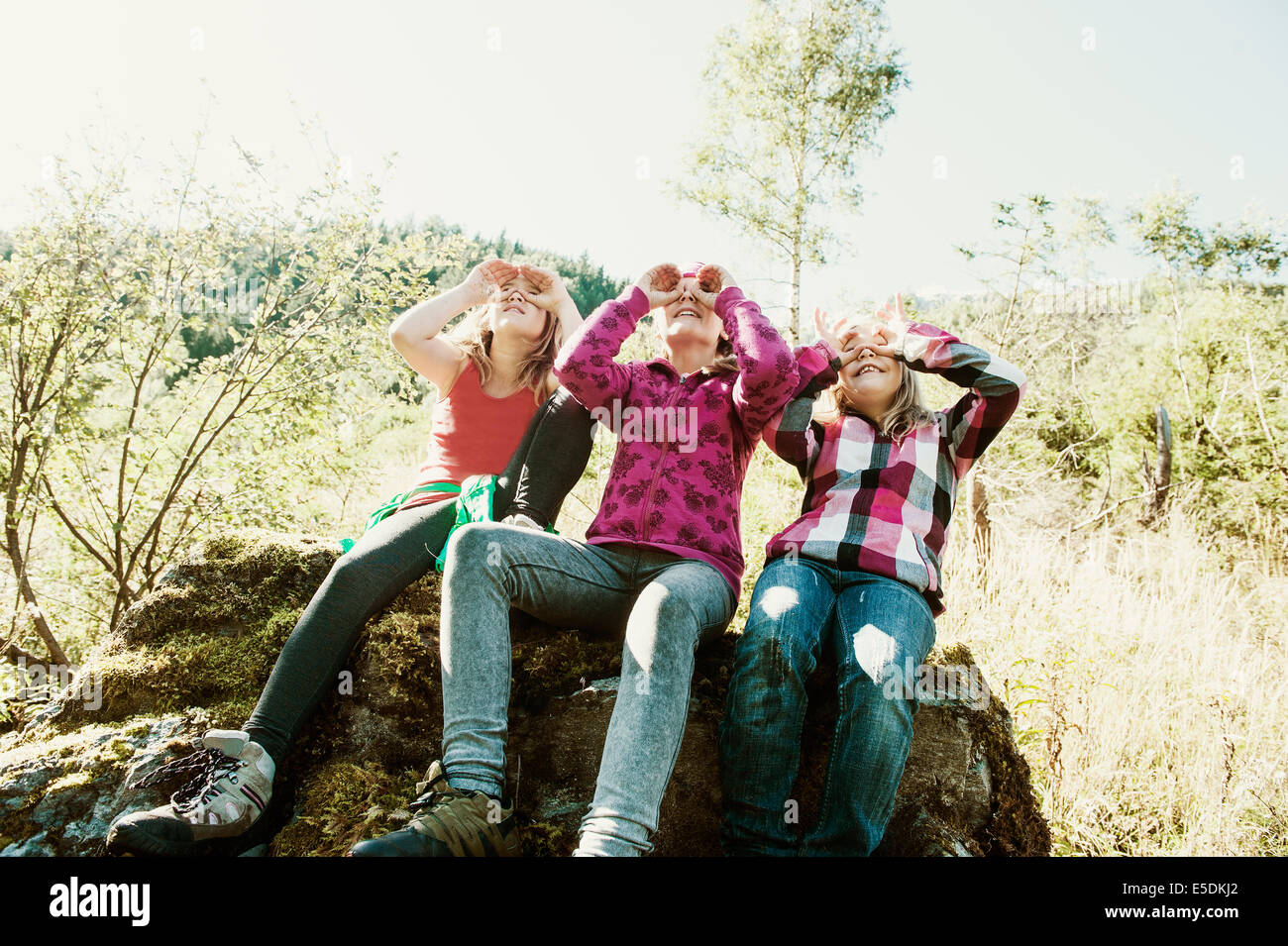 Three girls exploring the nature Stock Photo - Alamy