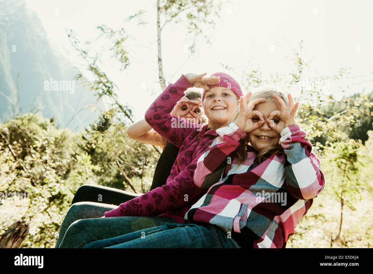 Three girls exploring the nature Stock Photo - Alamy