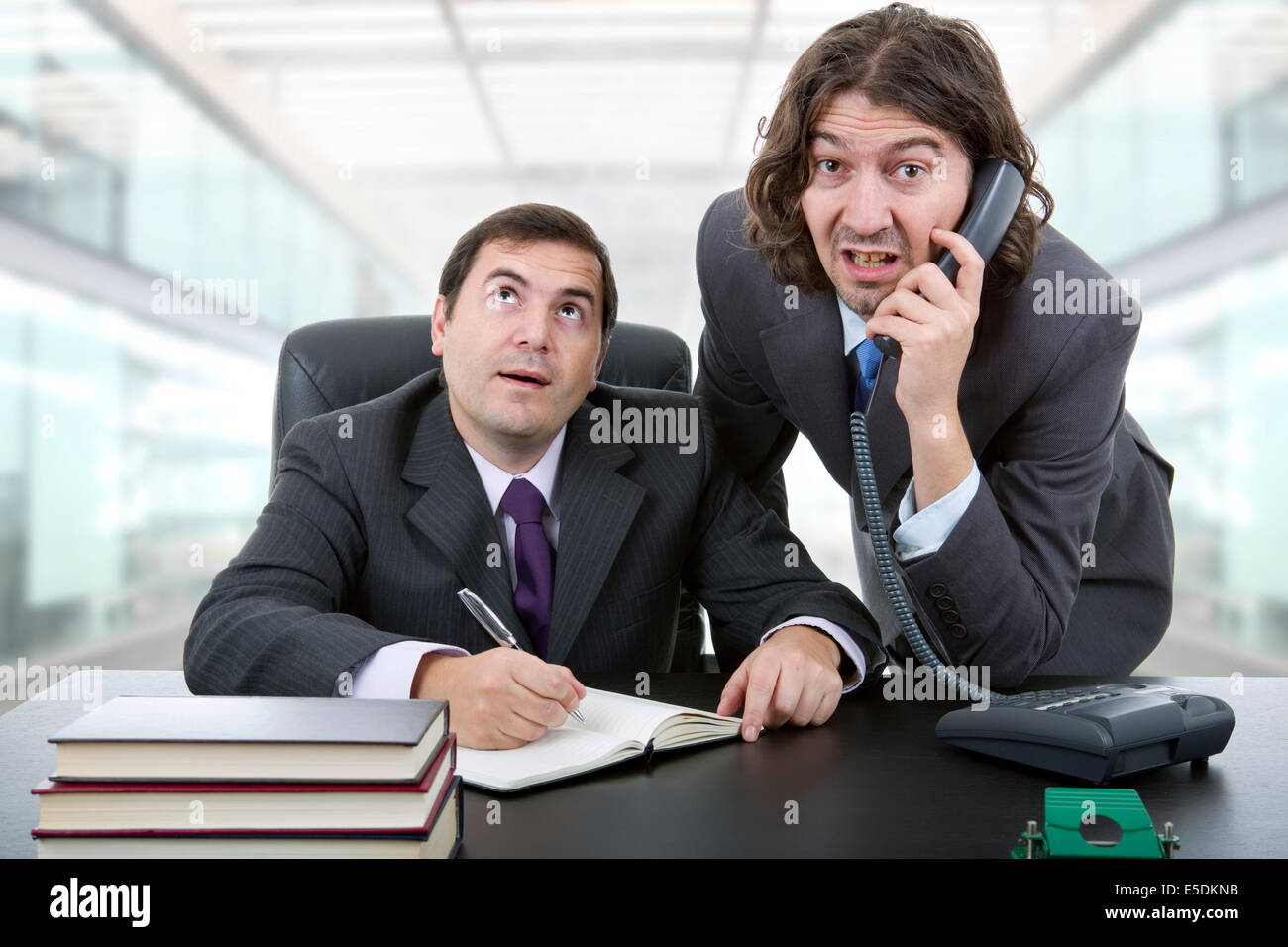 business team working at a desk, at the office Stock Photo - Alamy